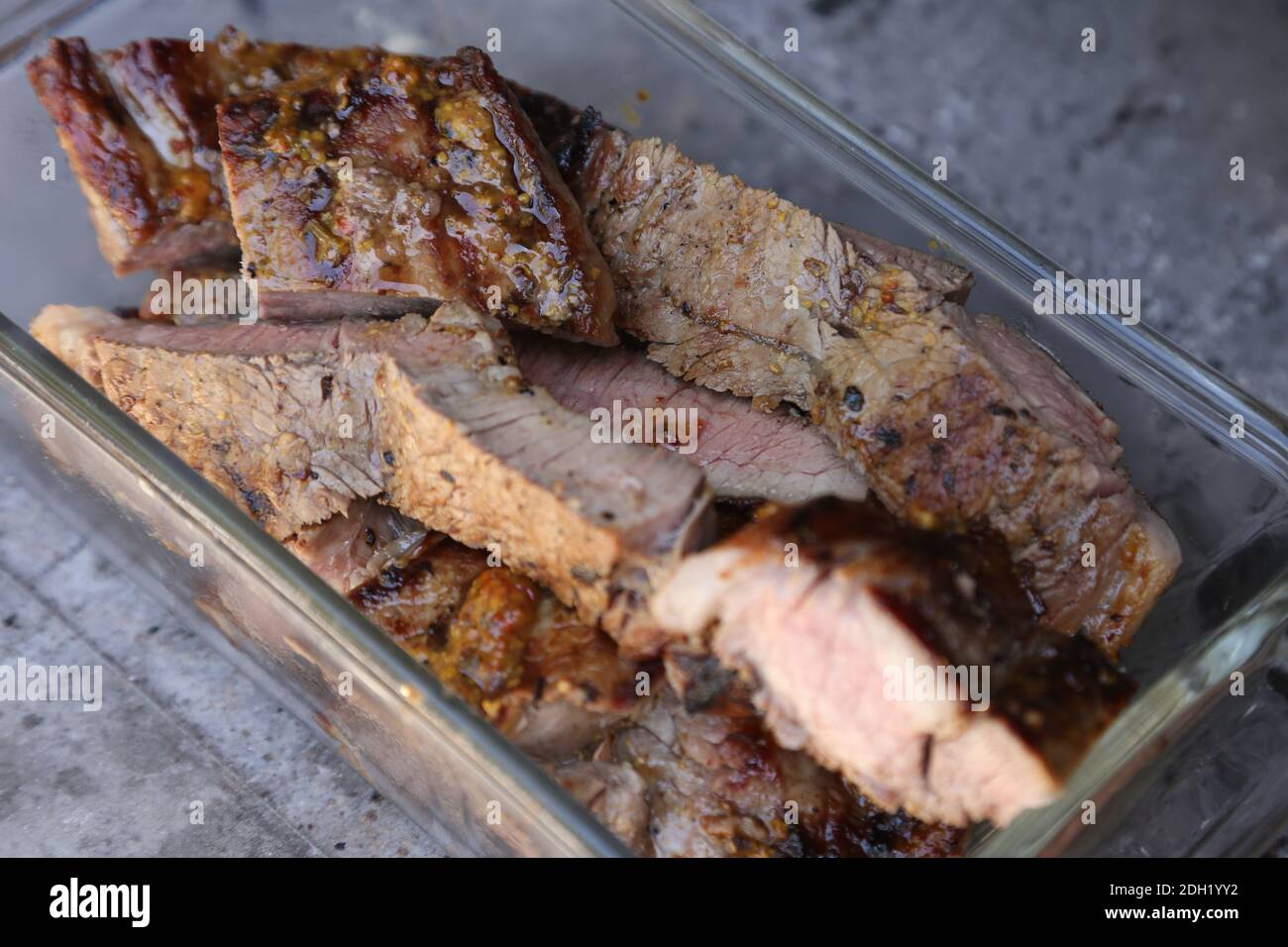 A high angle shot of deliciously cooked meat in a tray Stock Photo - Alamy