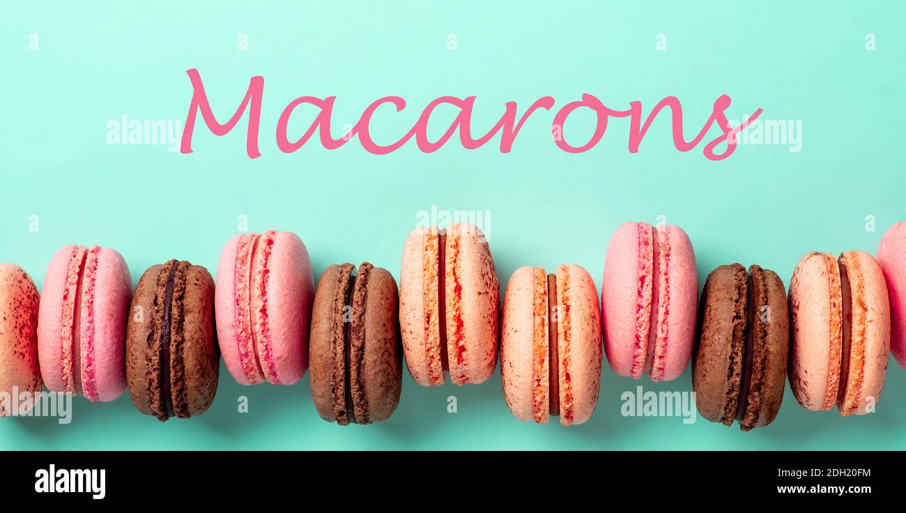 Letters macarons and row of macarons on turquoise Stock Photo - Alamy