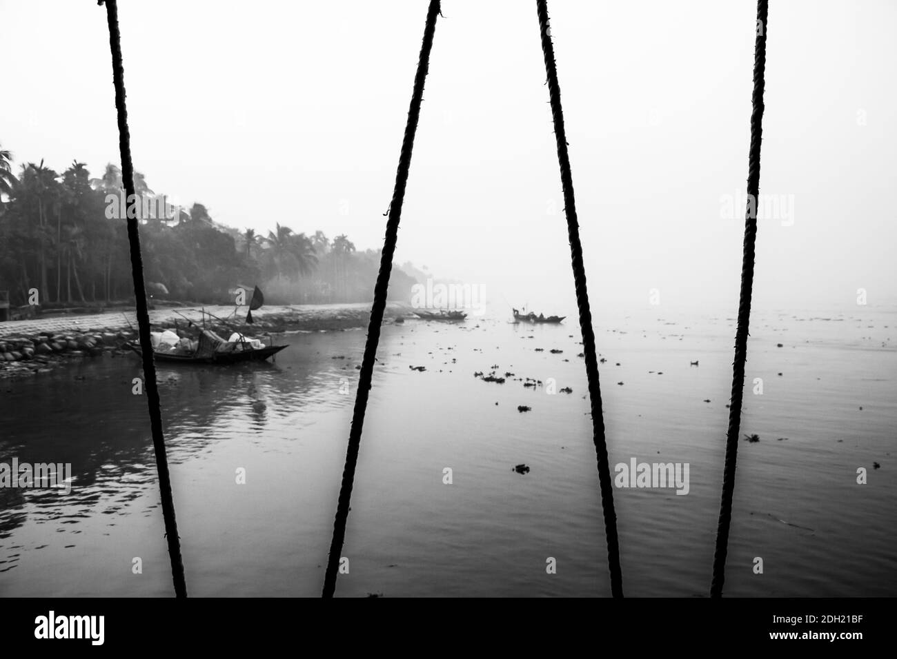 Foggy winter morning with river and boat. I captured this image ...