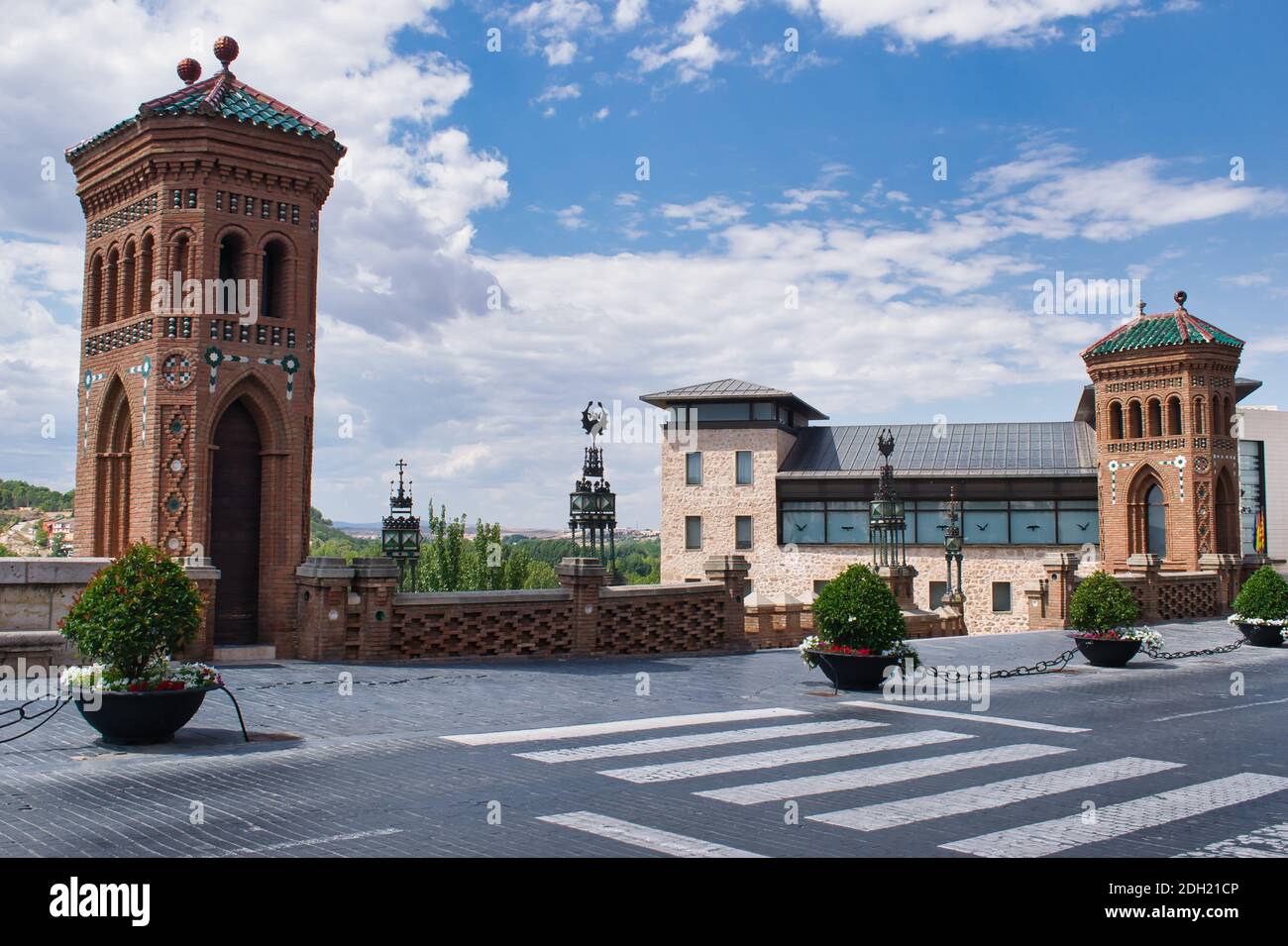 A small tower with Mudejar style architecture door at the top of the ...
