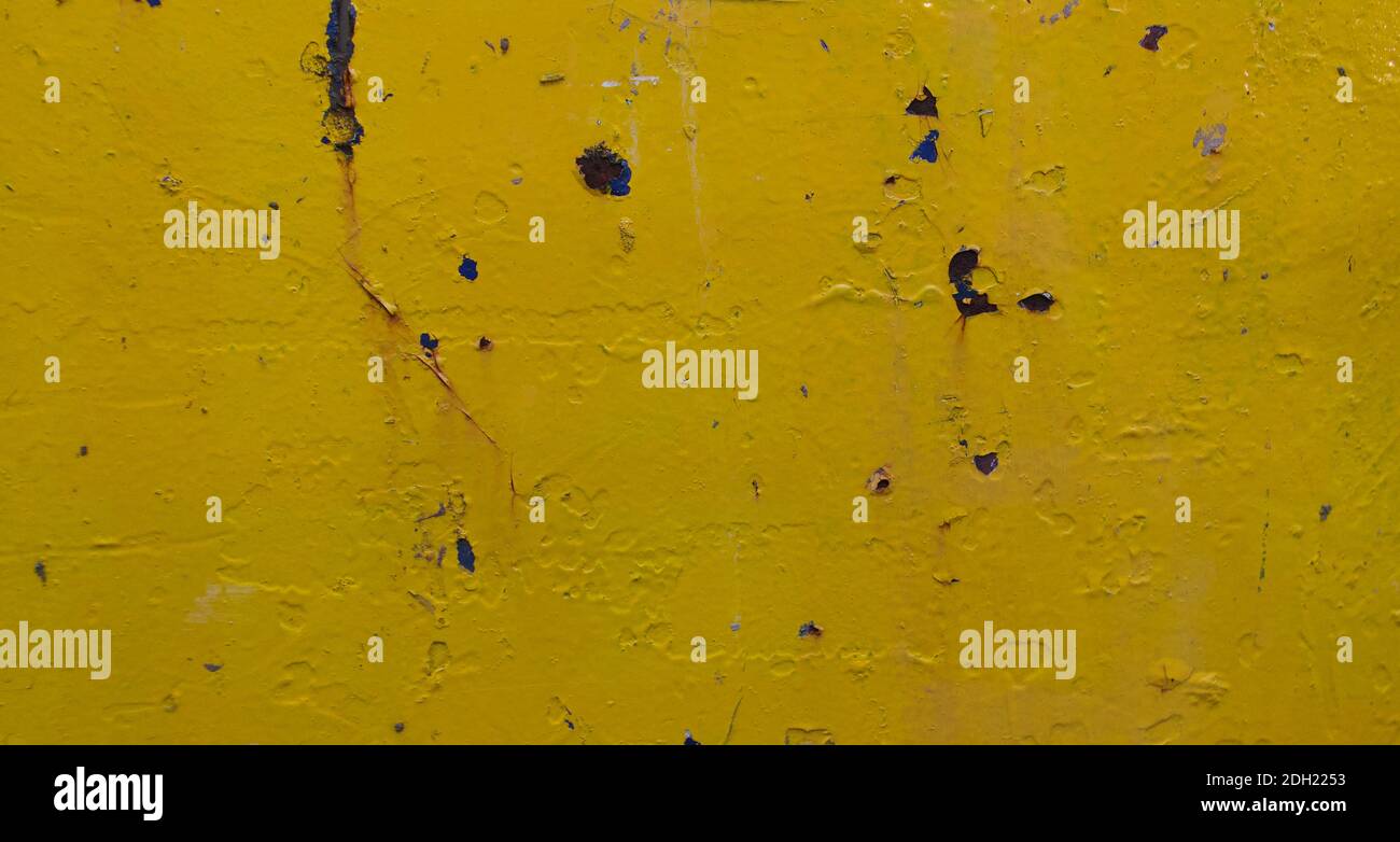 Scuffed and rusting old yellow metal background with copy space Stock ...