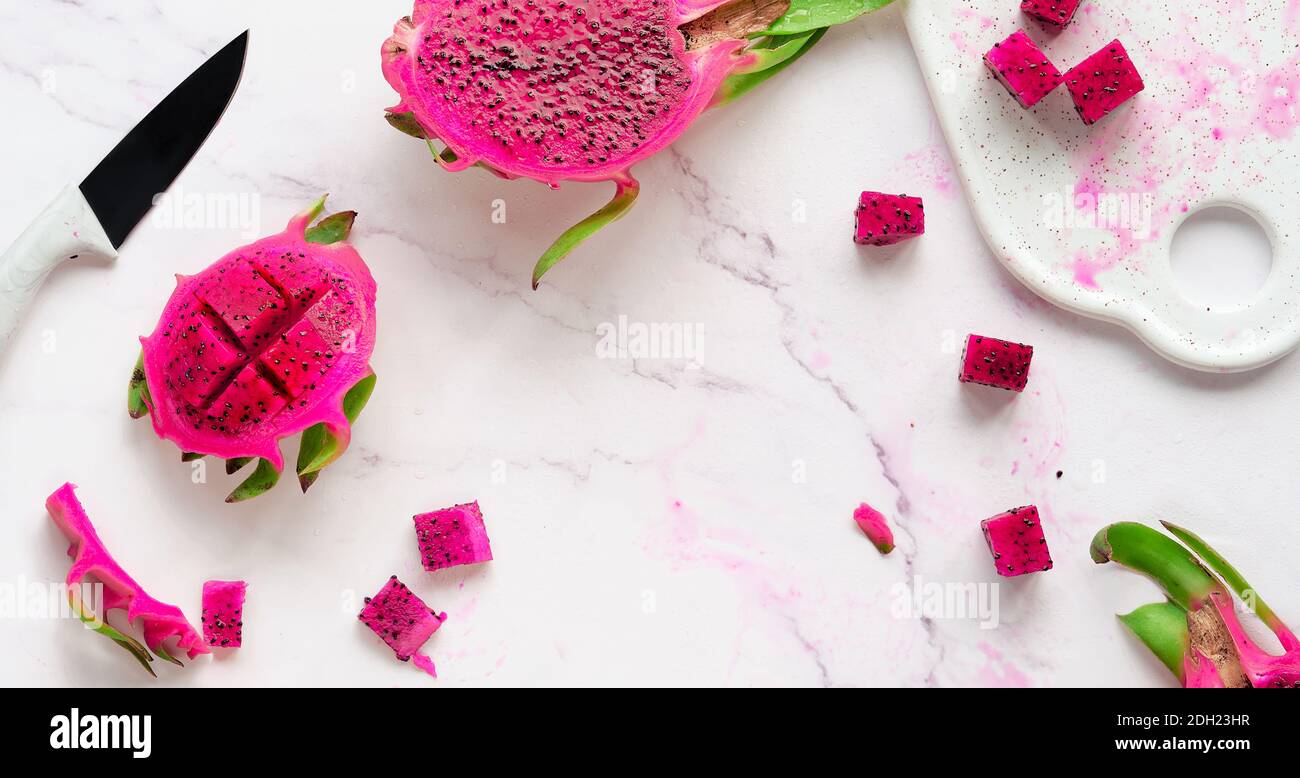 Ugly food. Juicy pink dragon fruit, pitaya, pitahaya sliced on marble ...
