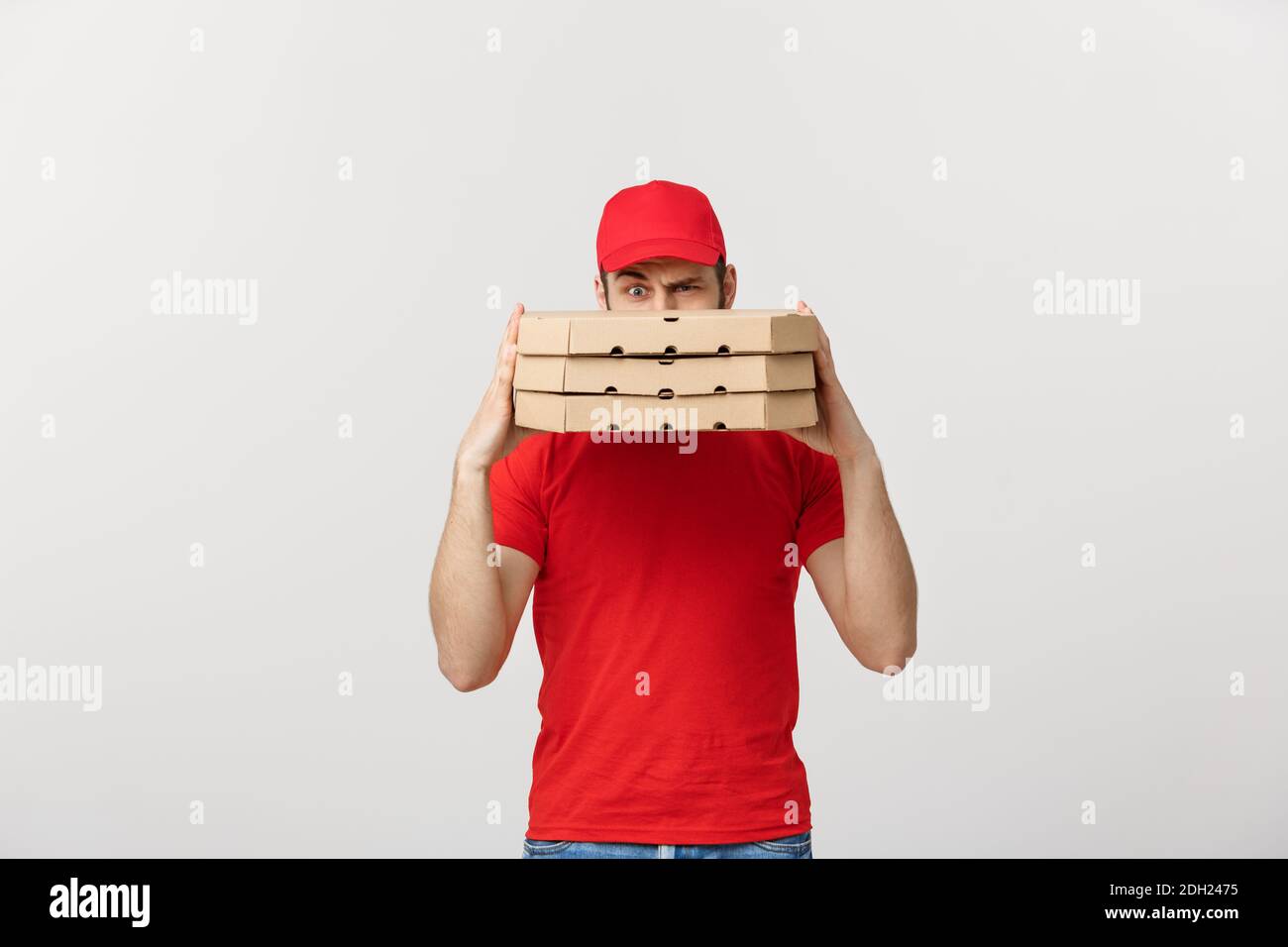 Man carrying stack pizza boxes hi-res stock photography and images - Alamy