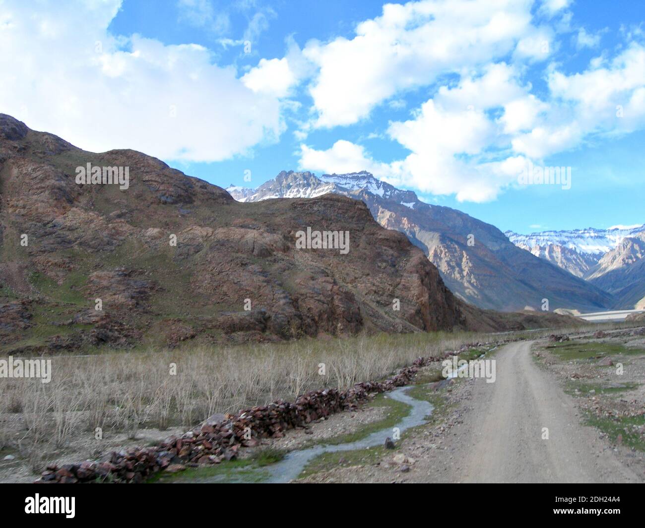 Alpine road winding through the Himalayan mountains in the Spiti valley ...