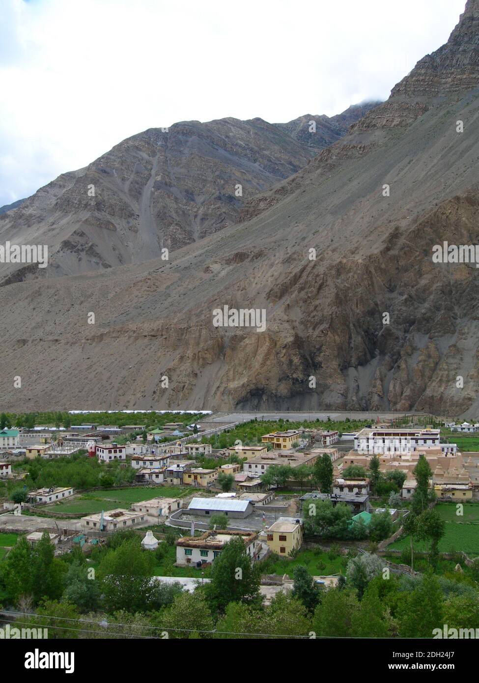 Aerial alpine background with a village seen while trekking the Spiti ...
