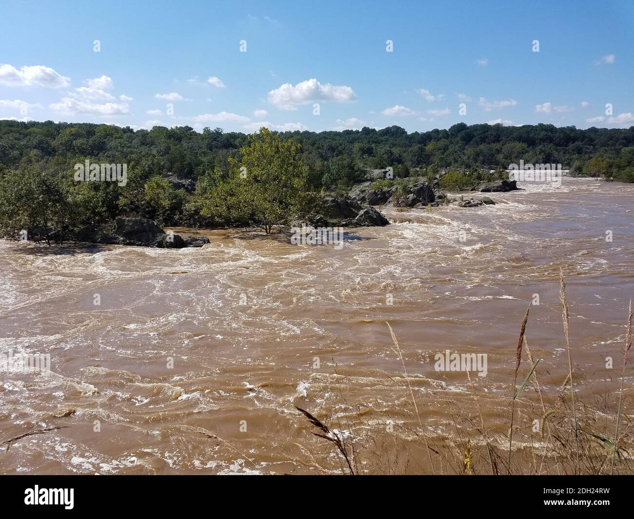 The Potomac river rapids swollen by heavy rains, at the Great Falls, in ...
