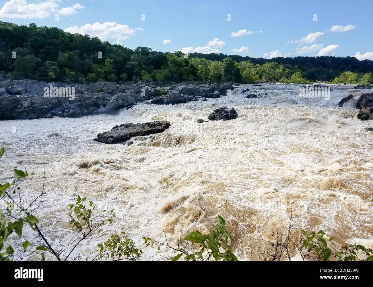 The Potomac river rapids swollen by heavy rains, at the Great Falls, in ...