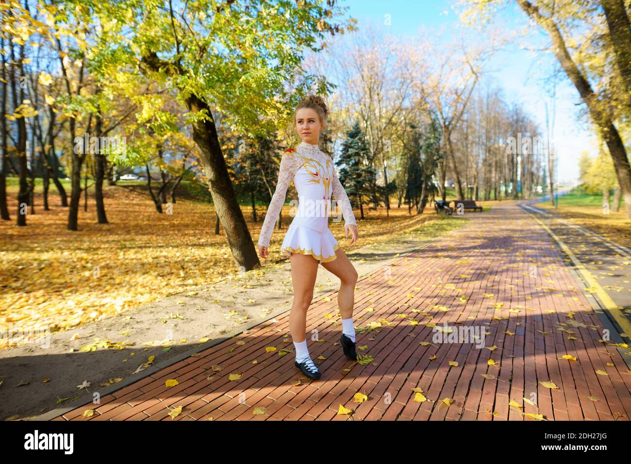 Ballerina dancing in nature park among autumn leaves Stock Photo - Alamy