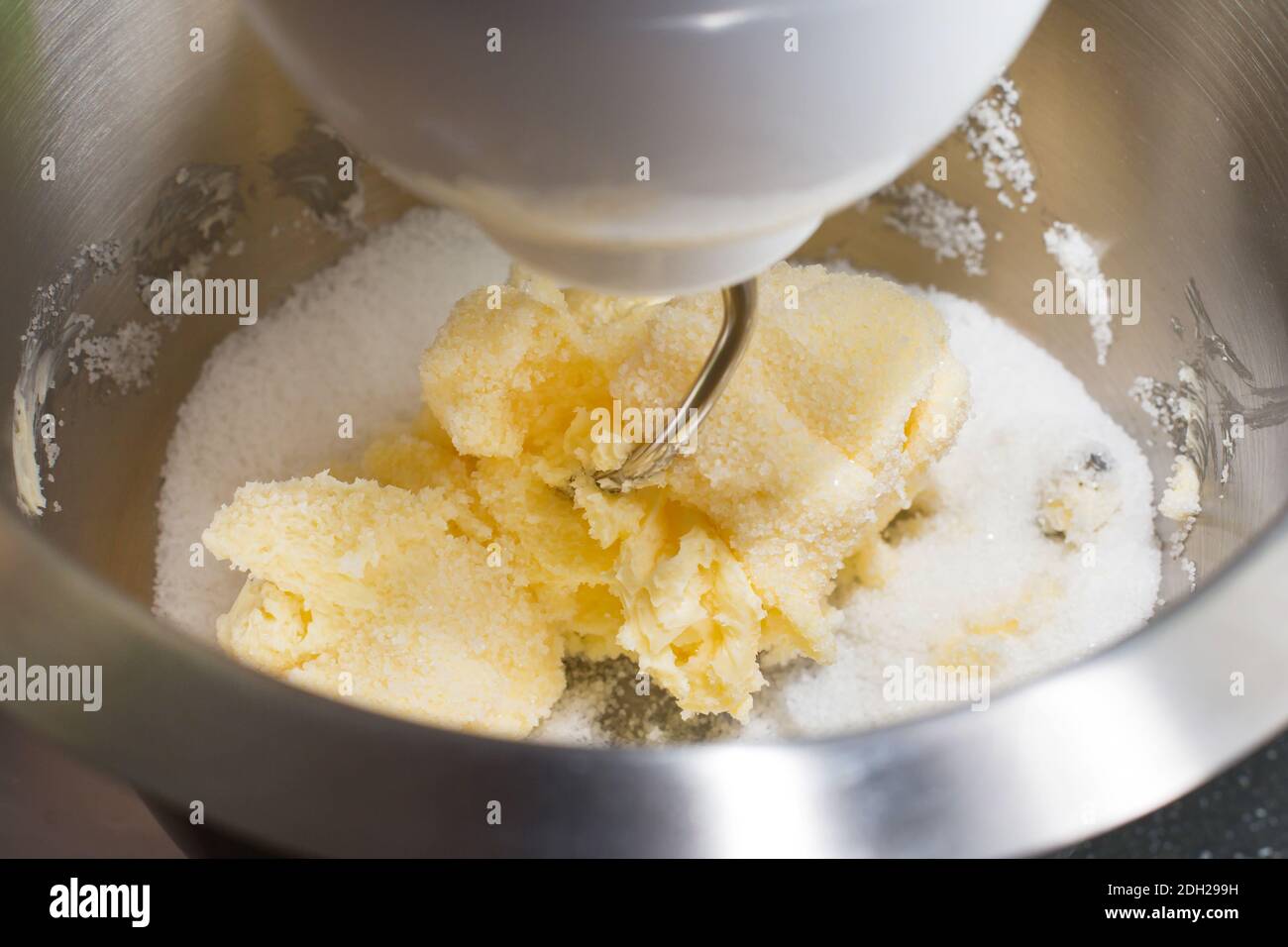 Mixing butter and sugar in mixing machine, homemade bakery, close up ...