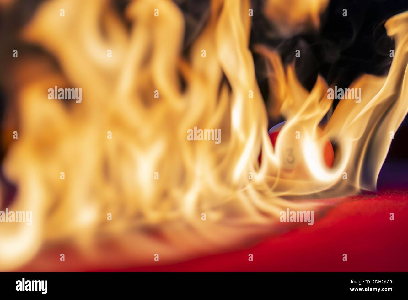 Pool Balls Are Lit On Fire While Sitting On A Pool Table In An Outdoor ...