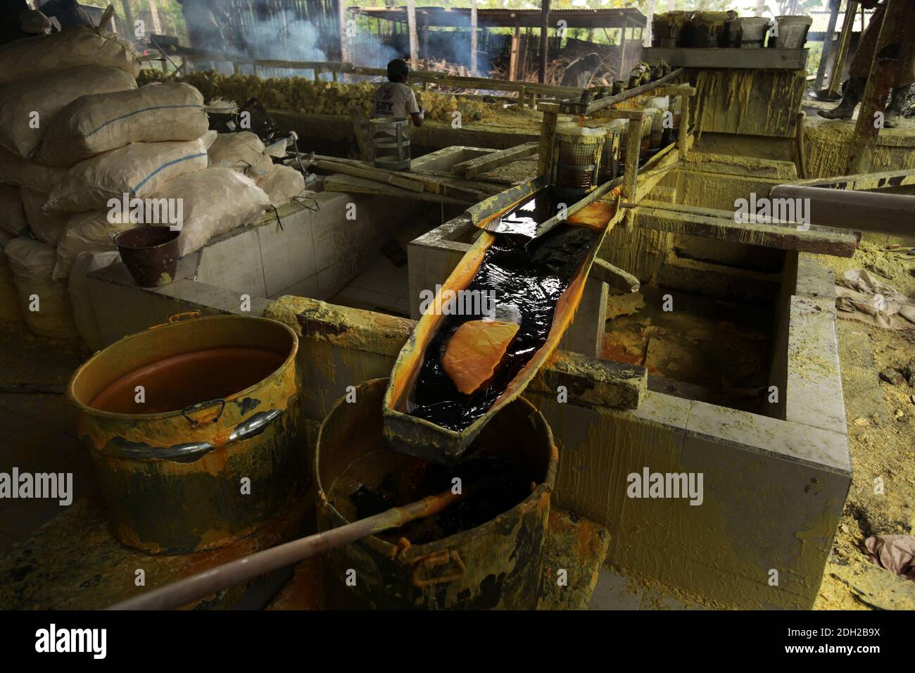 Molten sulphur being filtered at the sulphur factory in the village of ...