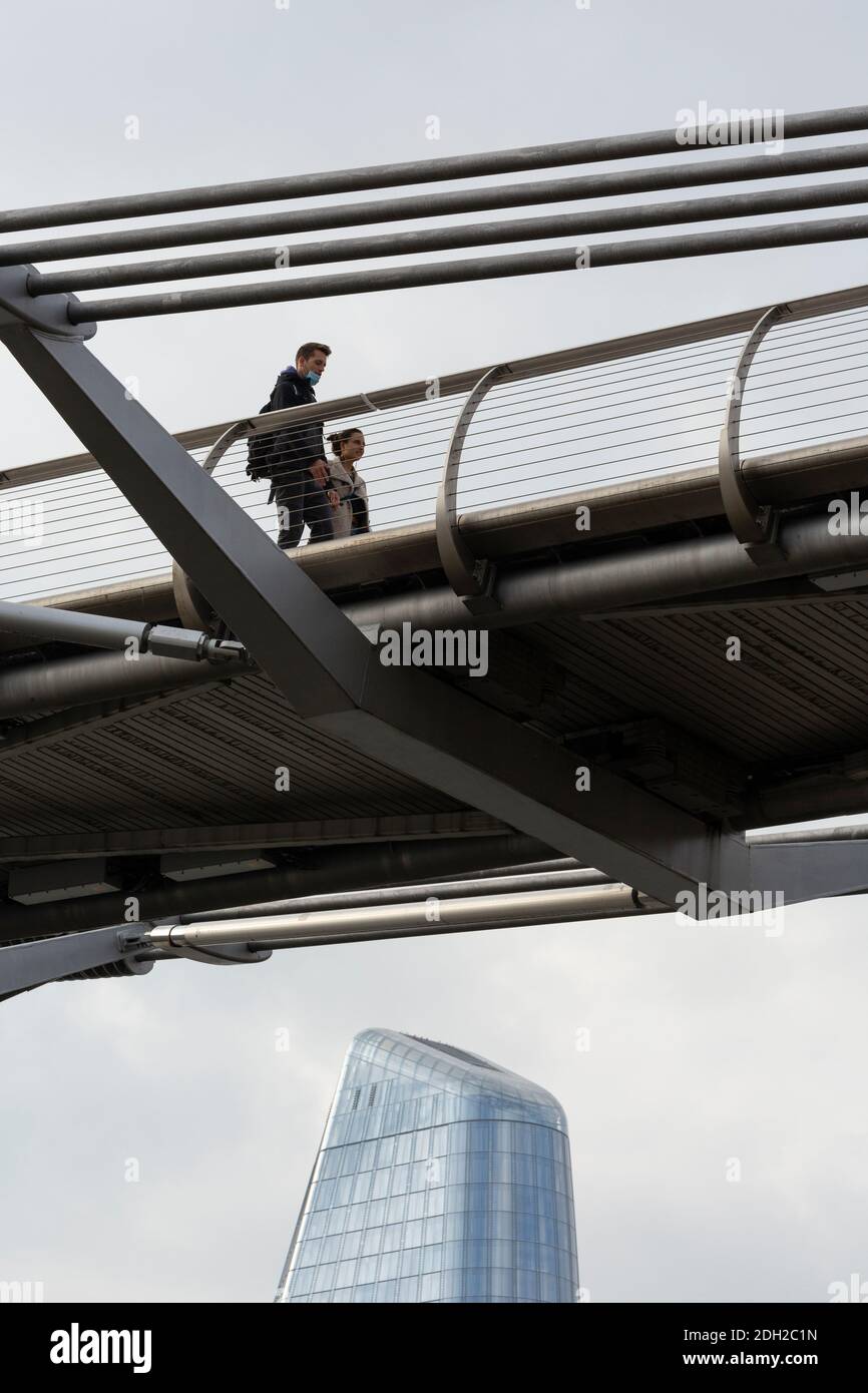 Two people crossing suspension bridge hi-res stock photography and ...