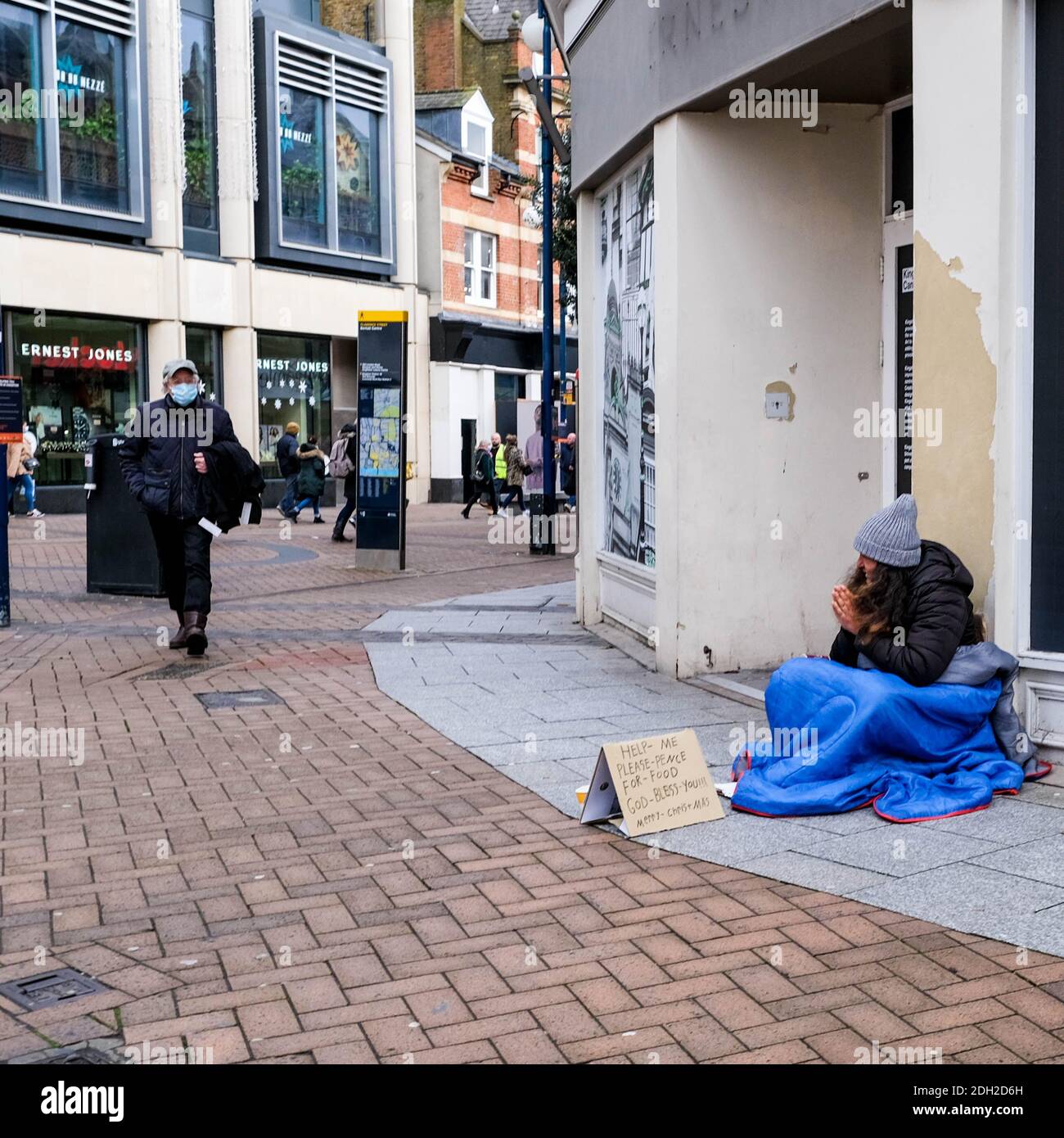 Collecting money in a hat hi-res stock photography and images - Alamy