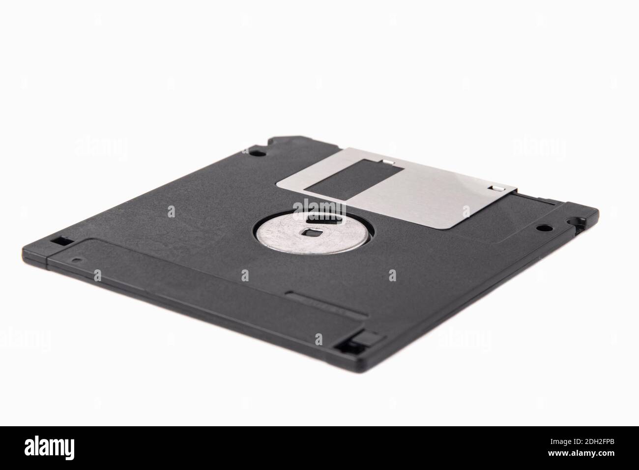 The back of a black floppy disk isolated on a white background. Close ...