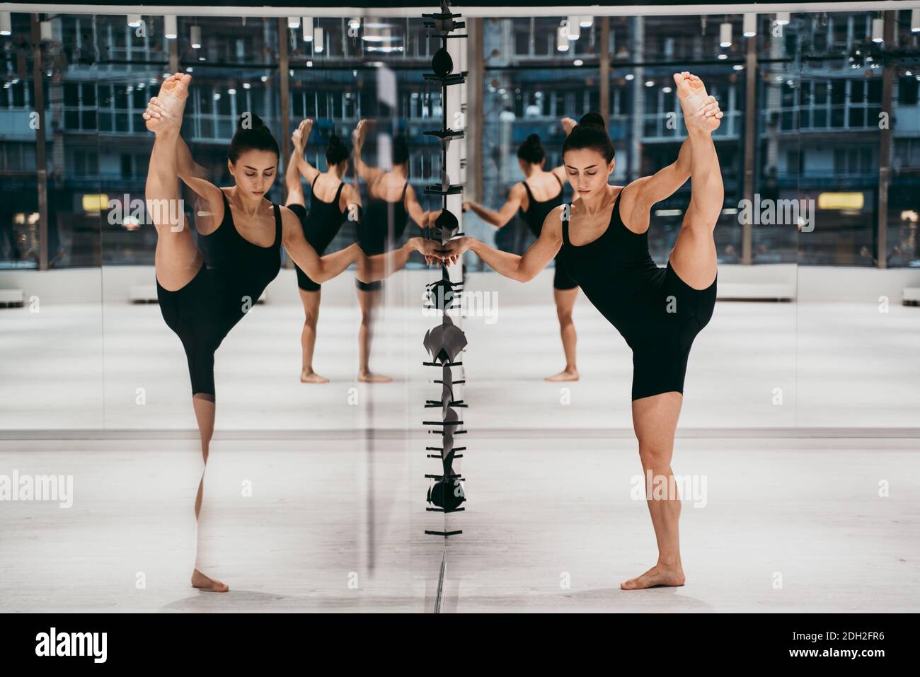 Beautiful girl training in the gym. Russian classic dancer doing ...