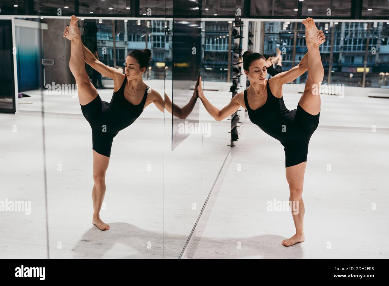 Beautiful girl training in the gym. Russian classic dancer doing ...