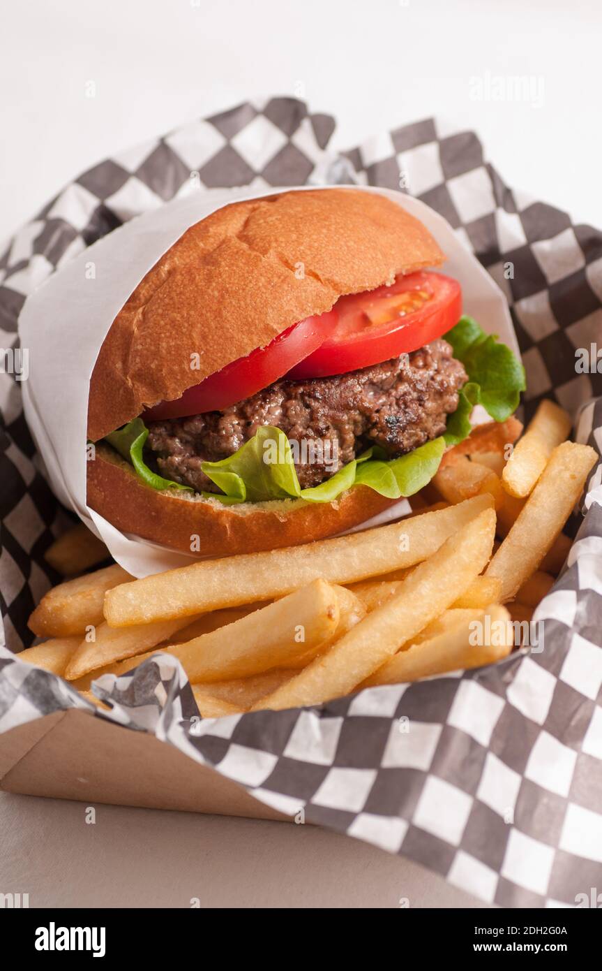 ethical meat beef hamburger with home made coleslaw and fries in a take ...