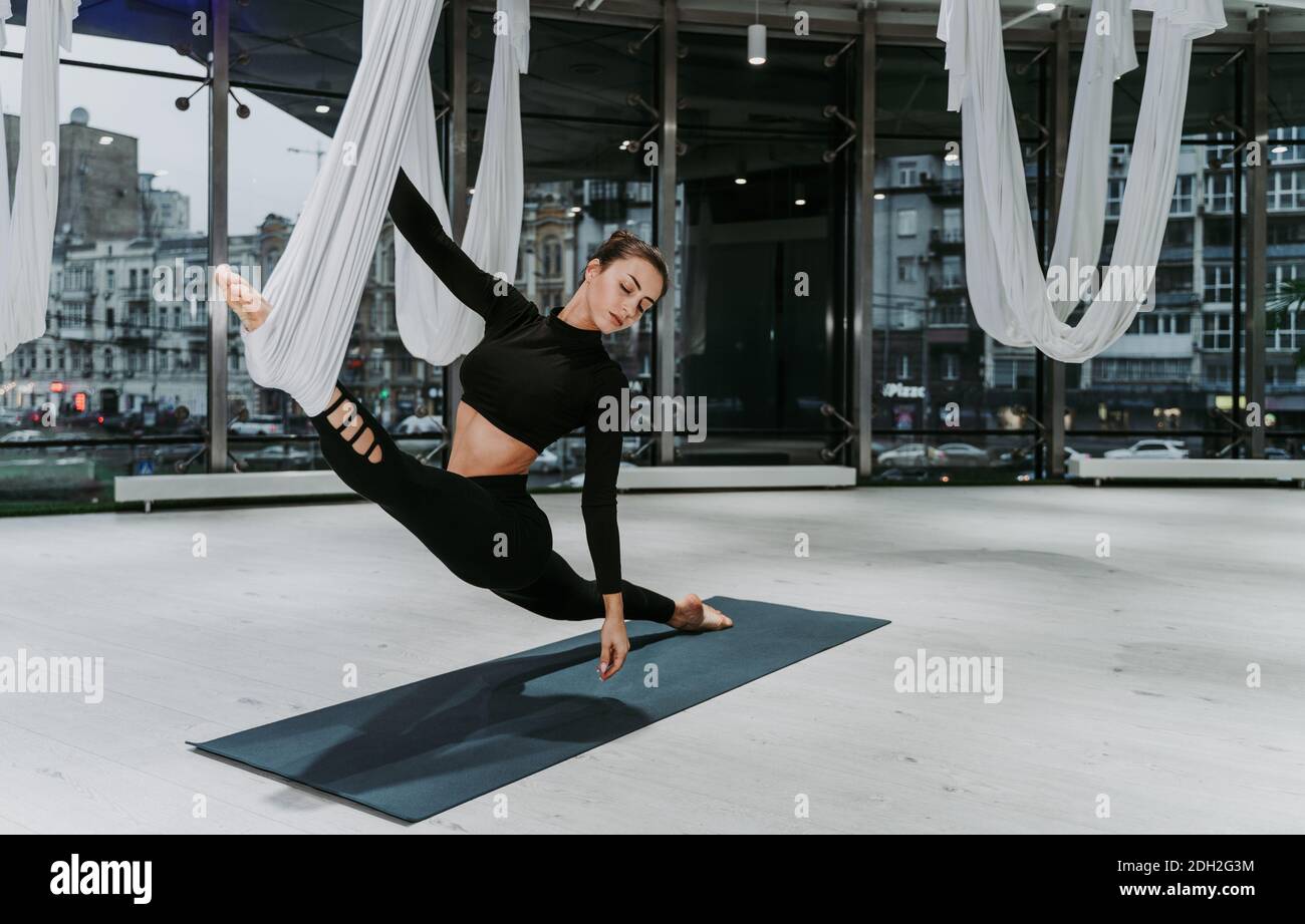 Beautiful girl training in the gym. Russian classic dancer doing ...