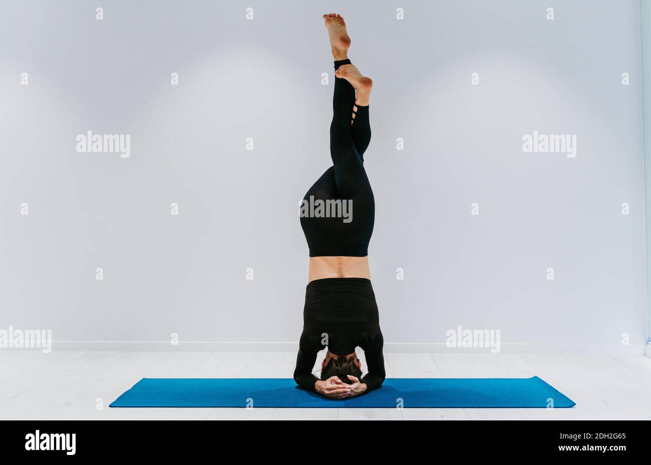 Beautiful girl training in the gym. Russian classic dancer doing ...