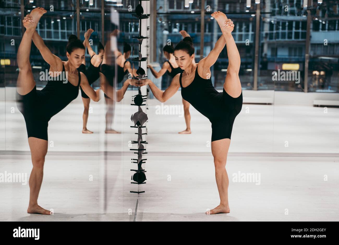 Beautiful girl training in the gym. Russian classic dancer doing ...