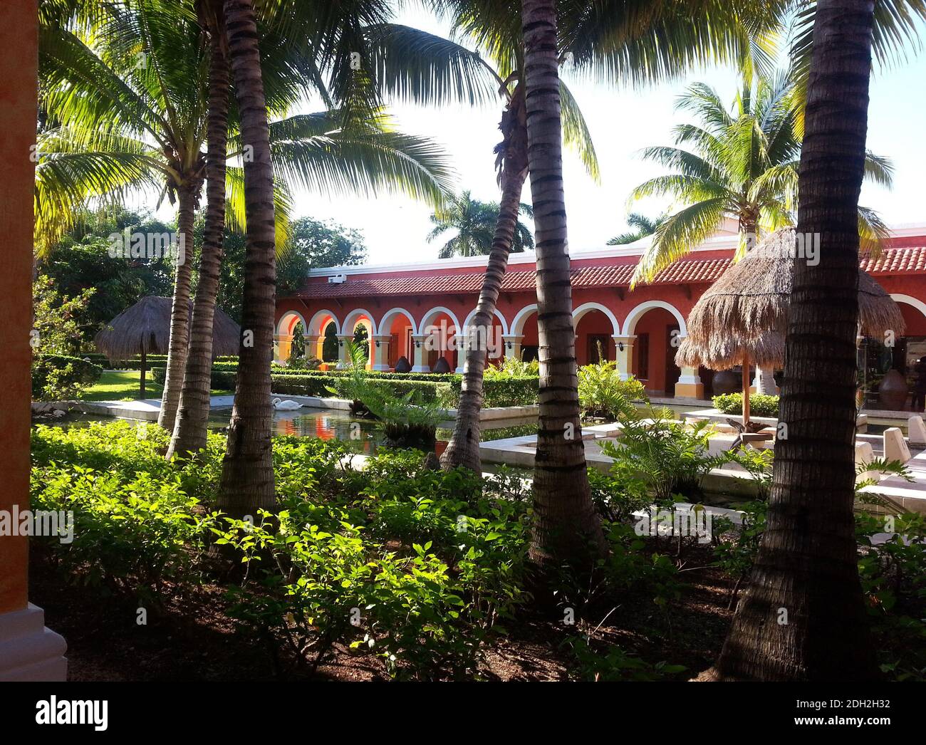 Caribbean architecture with colonnade and beautifully landscaped garden ...