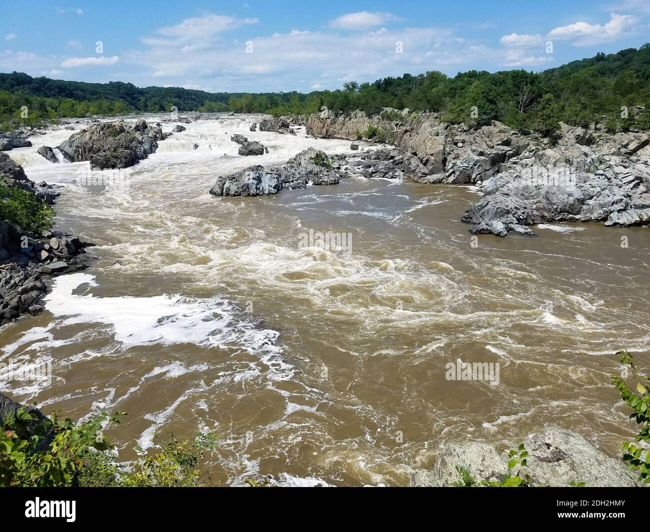 The Potomac river rapids swollen by heavy rains, at the Great Falls, in ...