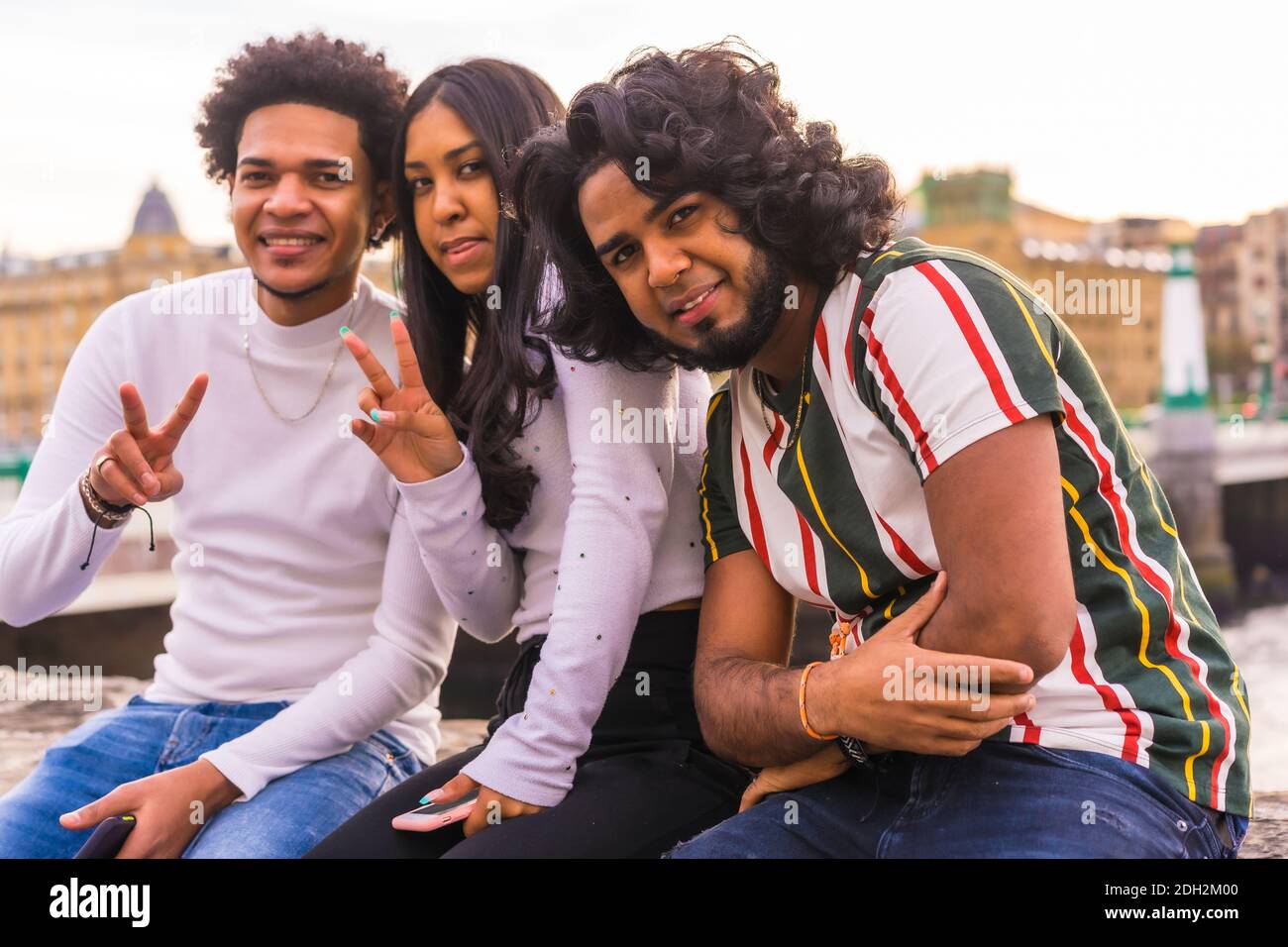 A shallow focus shot of young Latin friends posing at camera Stock ...