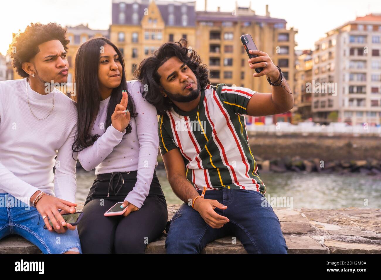 A shallow focus shot of young Latin friends having fun and taking a ...