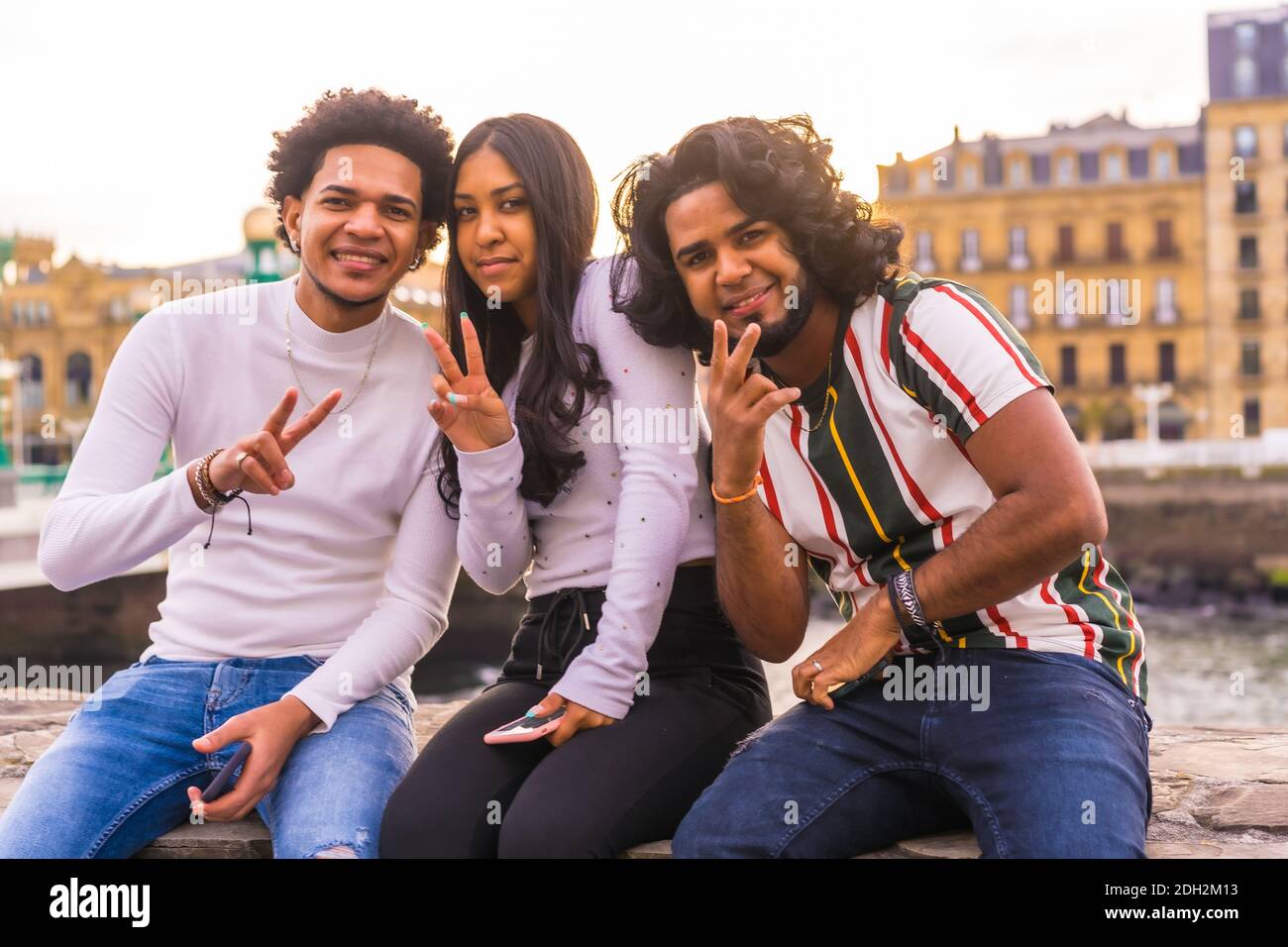 A shallow focus shot of young Latin friends posing at camera Stock ...
