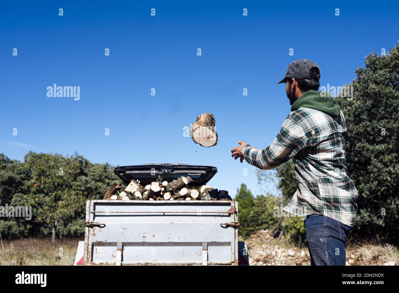 Man throwing firewood hi-res stock photography and images - Alamy