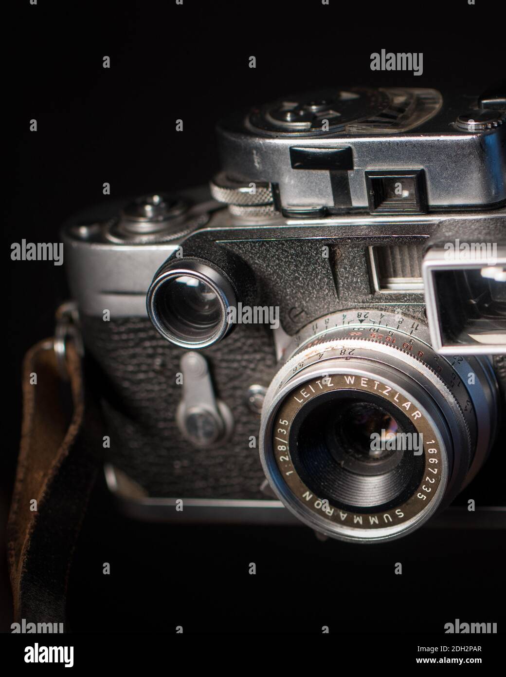 Vintage camera with roll-film close up, half the camera body and lens ...