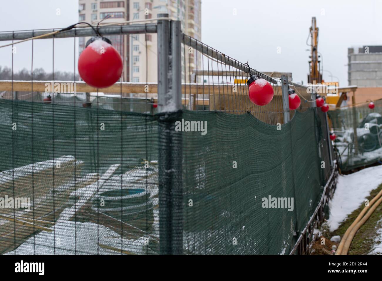 Construction site fencing, metal fence with mesh and red circular ...