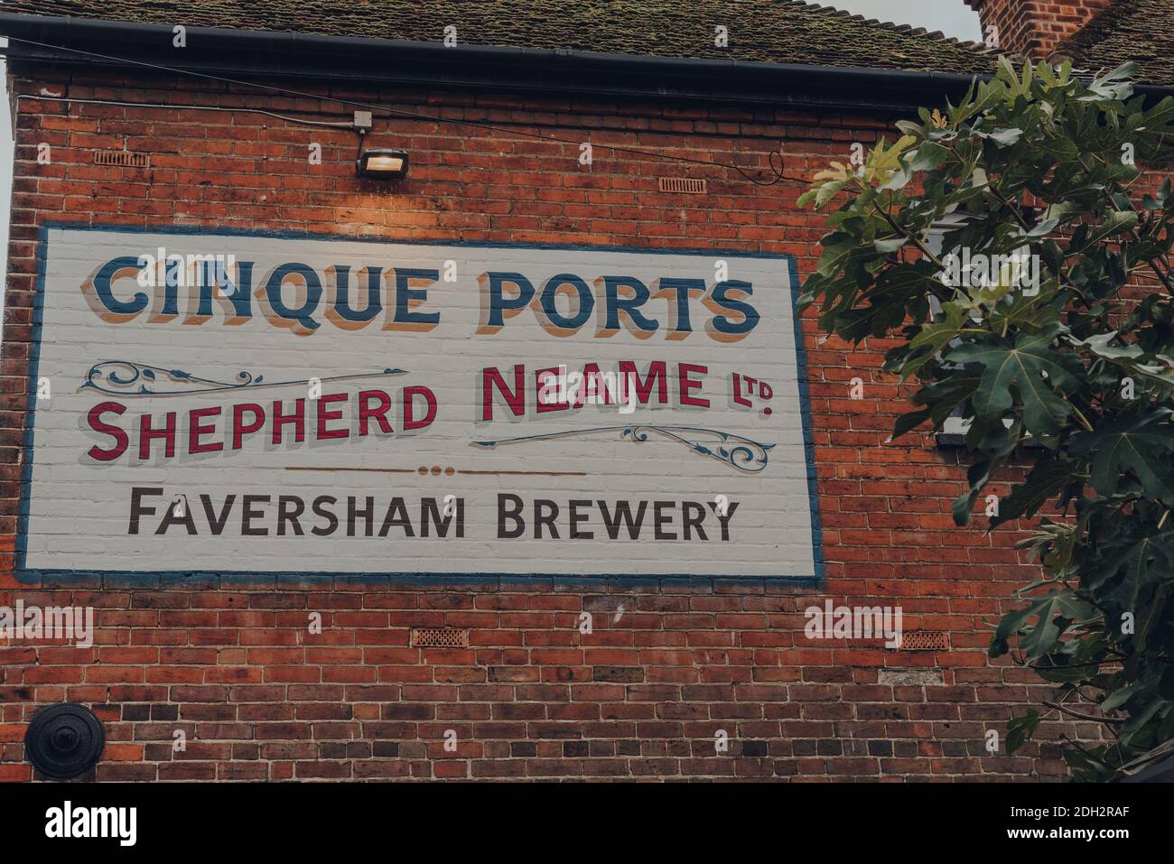 Rye, UK - October 10, 2020: Sign on a brick wall of Cinque Ports ...