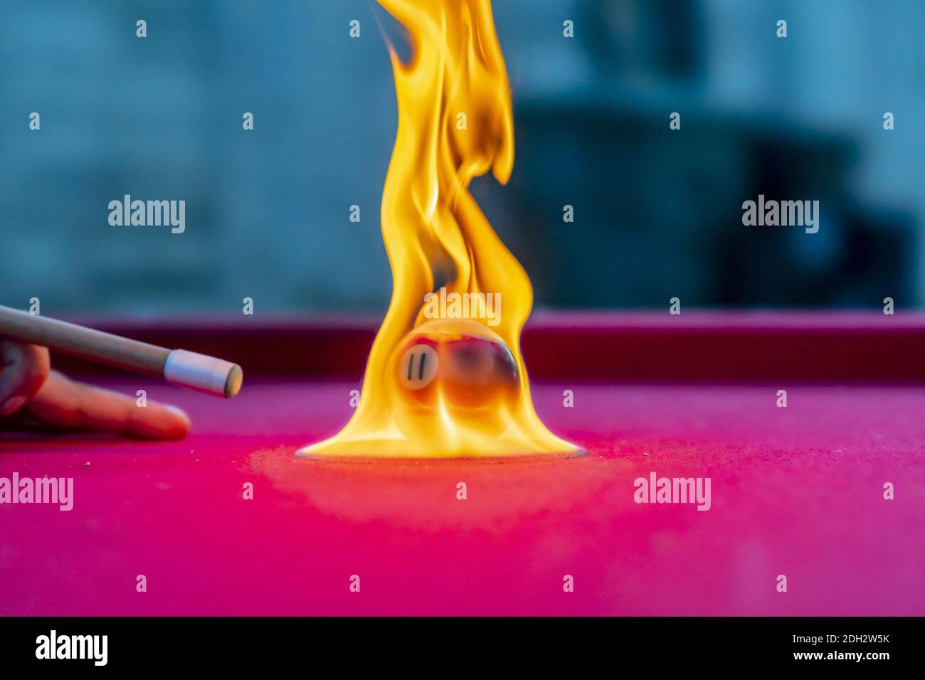 Pool Balls Are Lit On Fire While Sitting On A Pool Table In An Outdoor ...