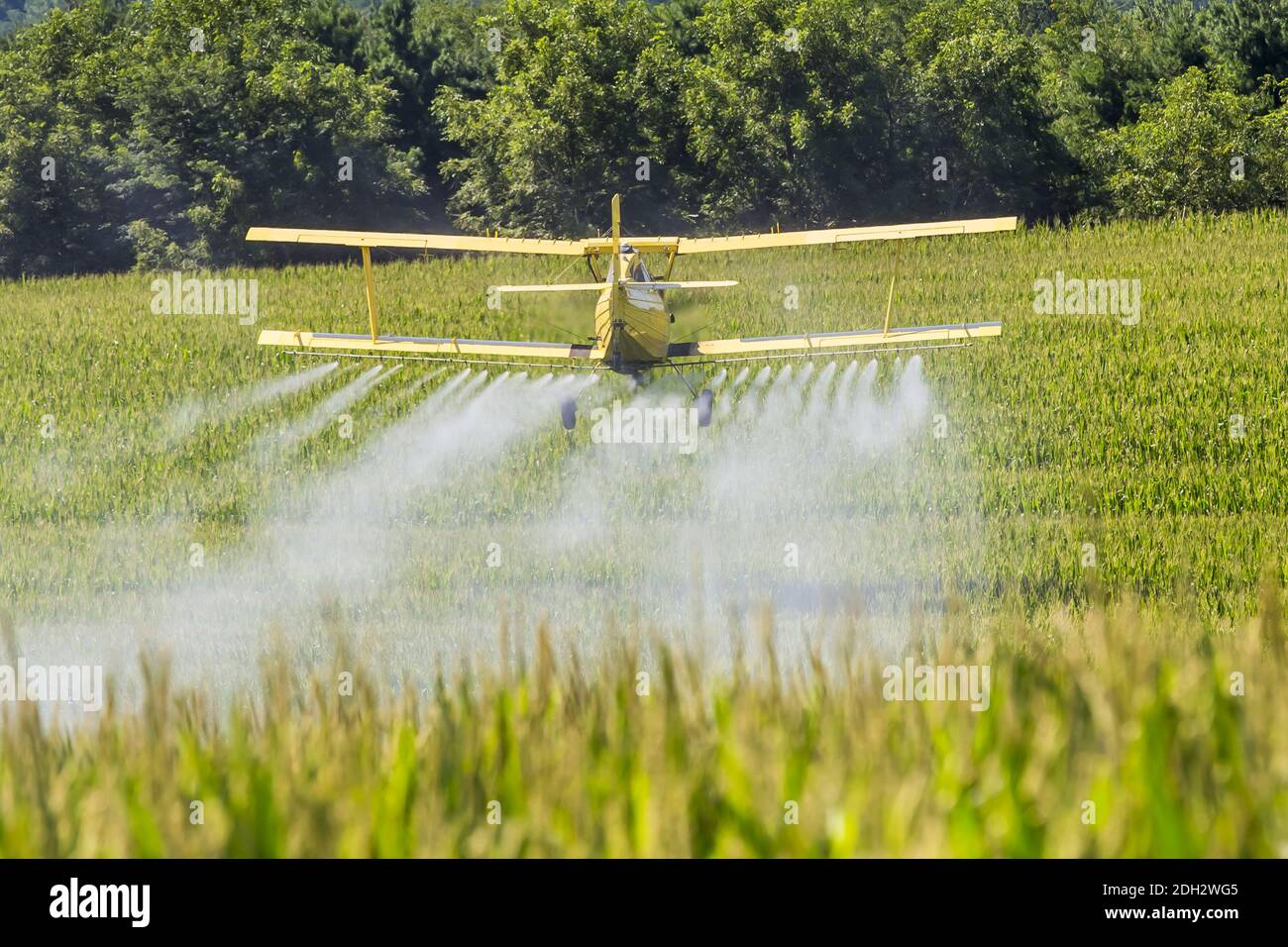 Crop duster spraying herbicide on hi-res stock photography and images ...