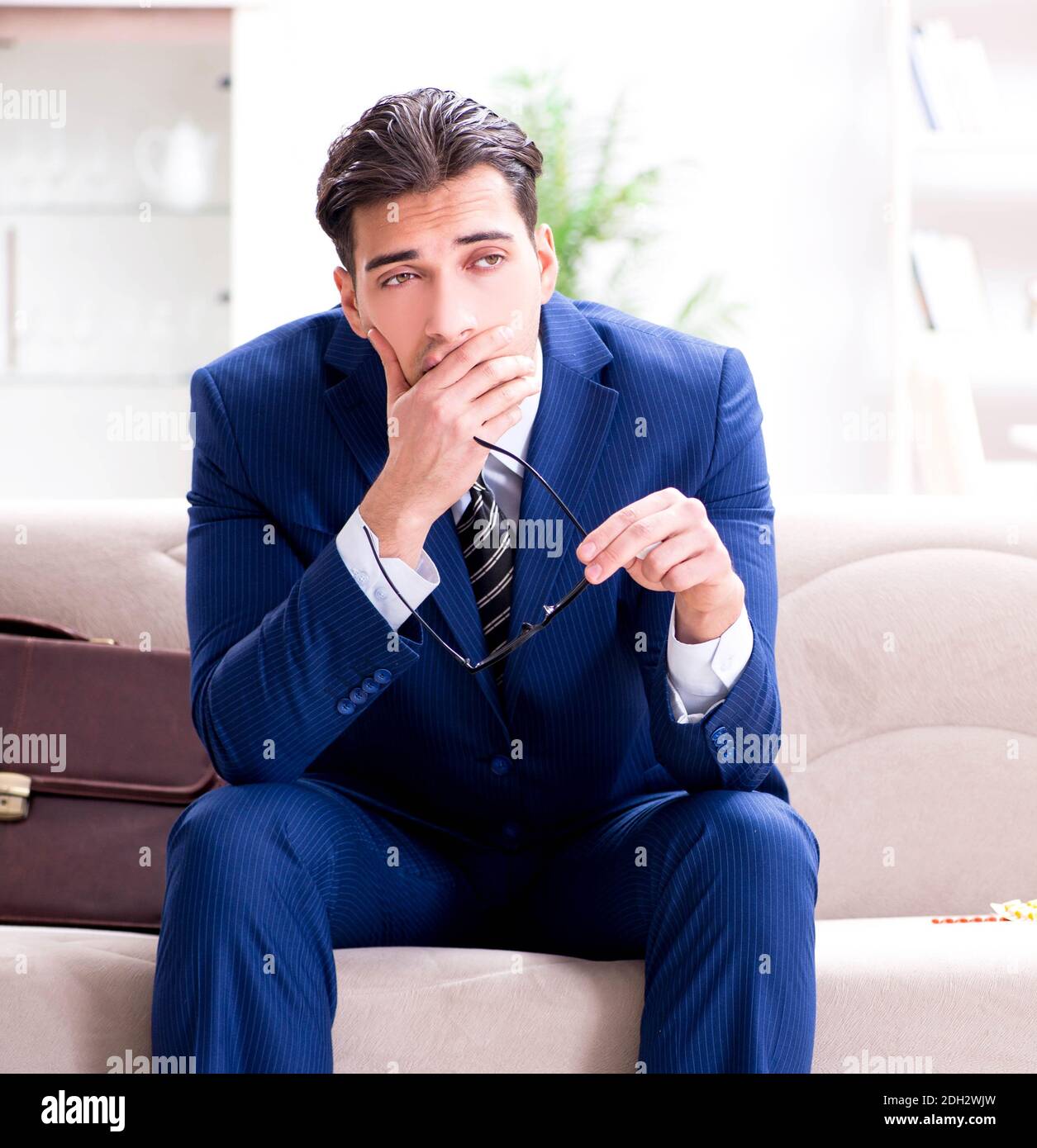 Sick employee staying at home suffering from flue Stock Photo - Alamy