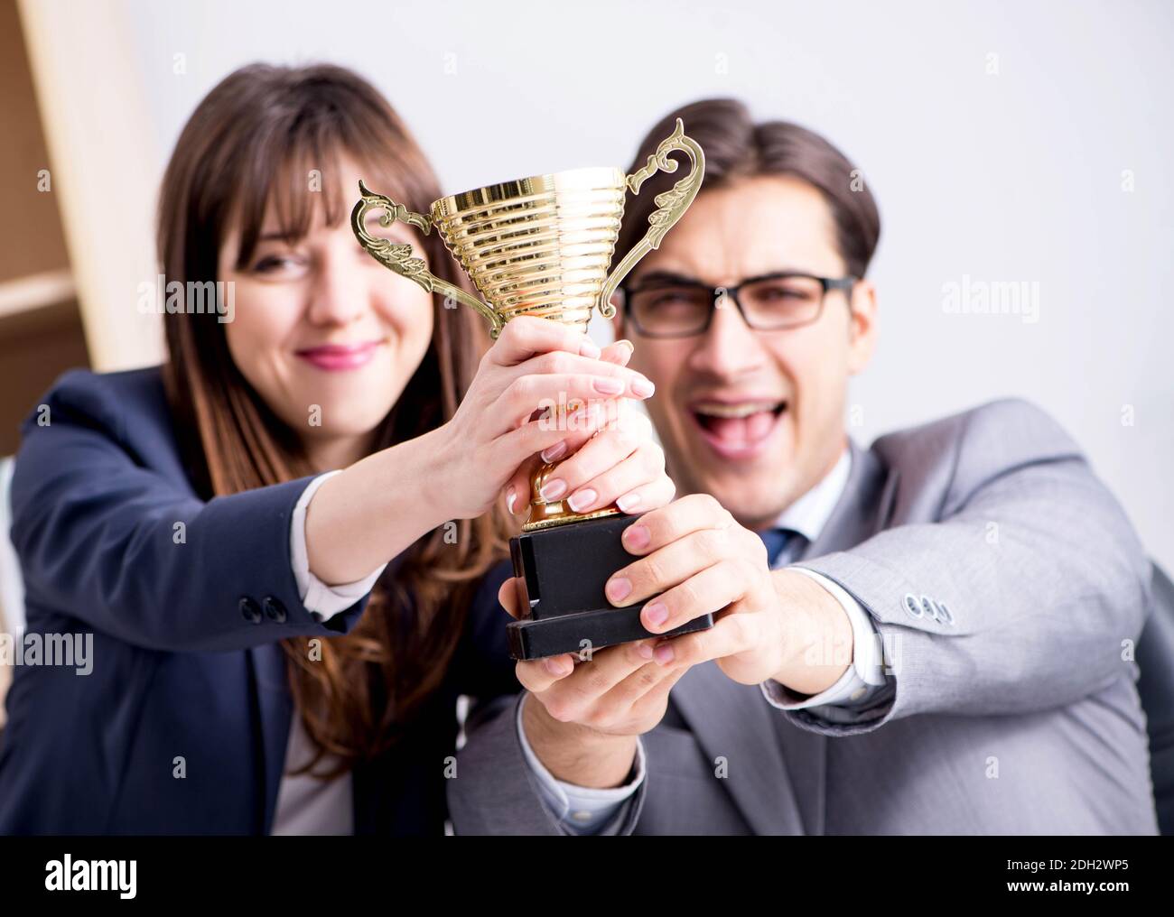 Concept of teamwork with prize Stock Photo - Alamy