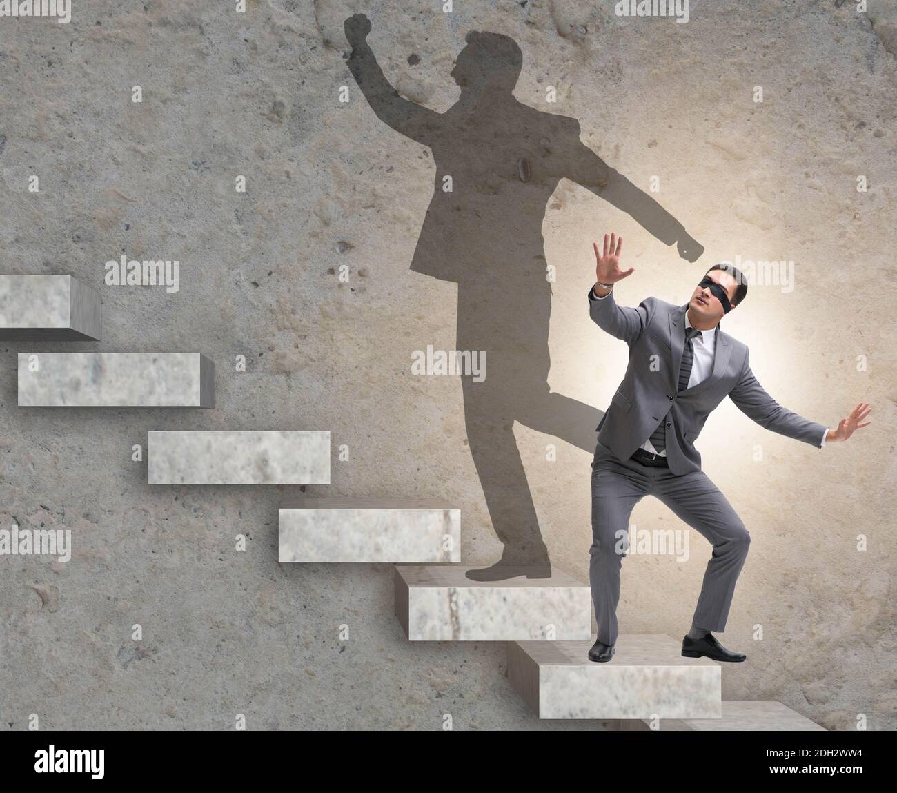Businessman and his shadow in business concept Stock Photo - Alamy