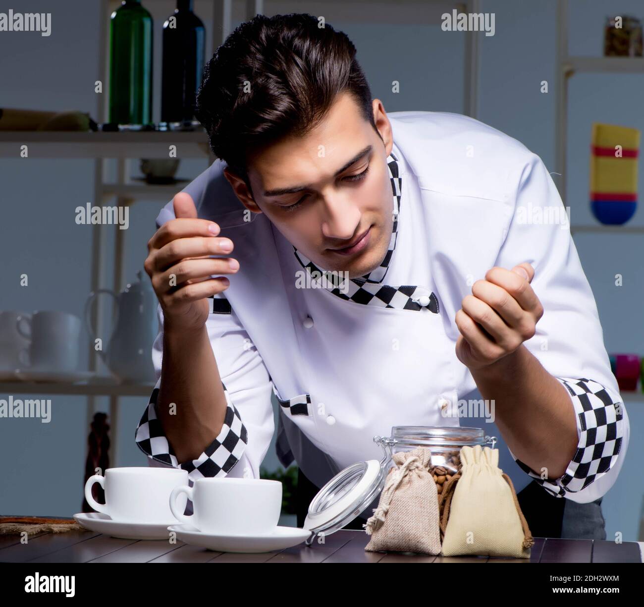 Coffee barista working late in shop preparing drinks Stock Photo - Alamy