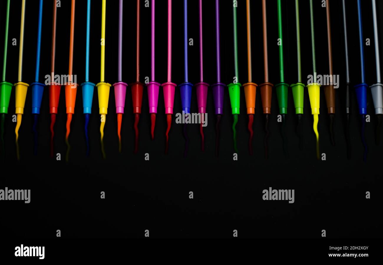 A set of rainbow markers on black background Stock Photo - Alamy