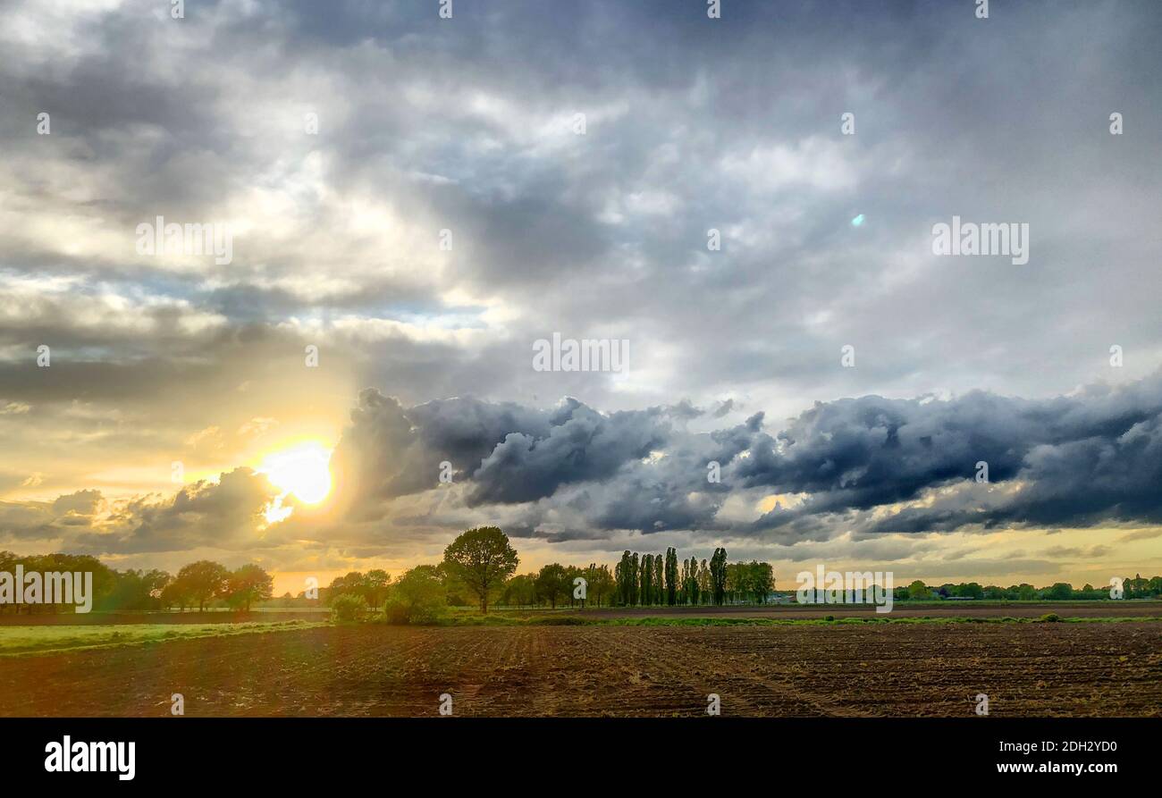Countryside sunrise over the fields showing the dramatic colors in the ...