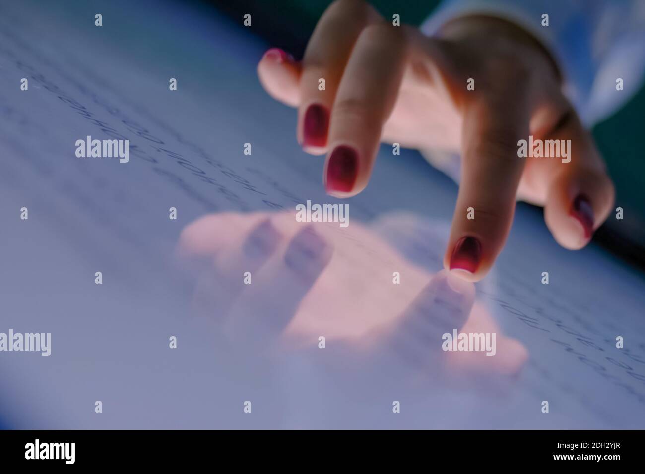 Woman using interactive touchscreen display at modern museum or ...