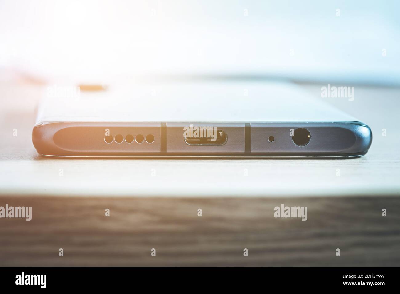 Plugs of a modern smartphone. Headphone jack and usb type c Stock Photo ...