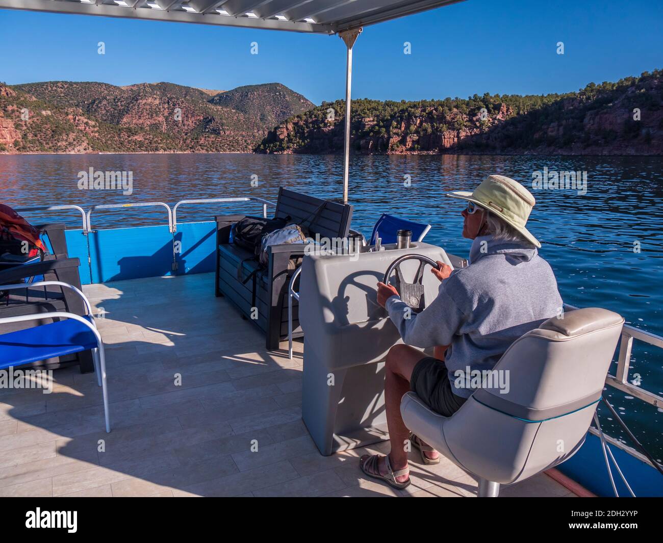 Female captain at the helm, Flaming Gorge Reservoir, Flaming Gorge ...