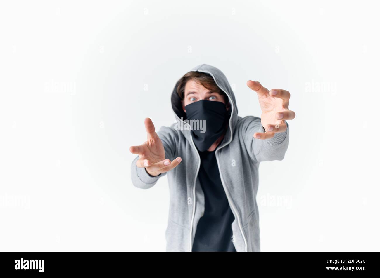 Anonymous person with gun Cut Out Stock Images & Pictures - Alamy