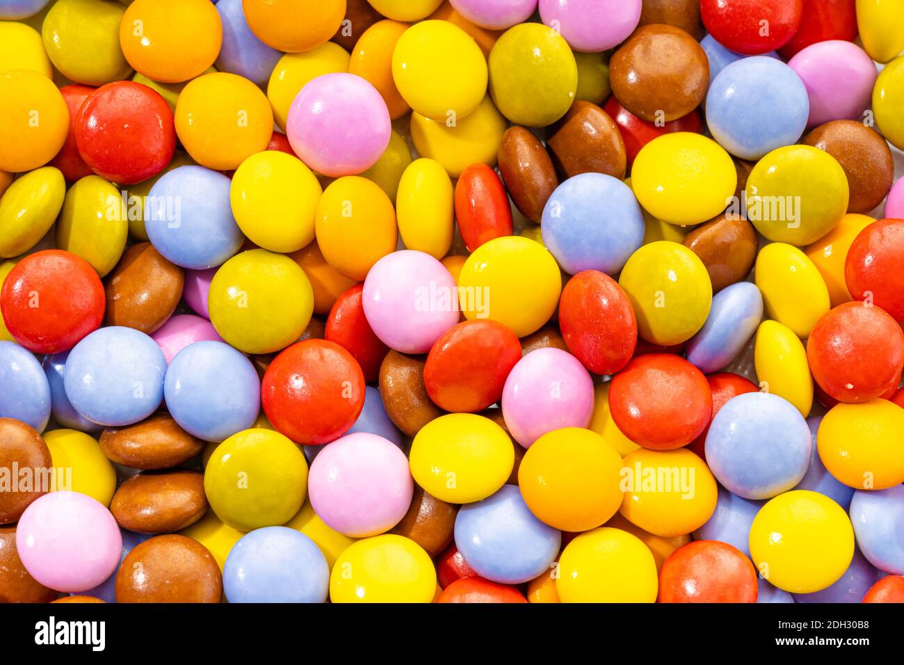 Multicolored Chocolate candy background. Top view Stock Photo - Alamy