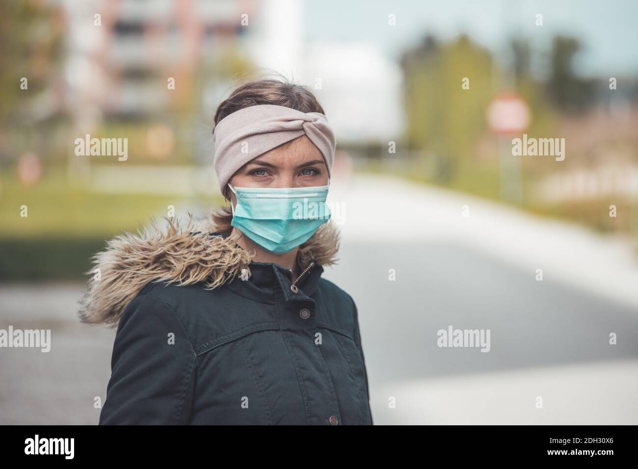 Flue and corona safety concept. Woman wearing face mask to protect ...