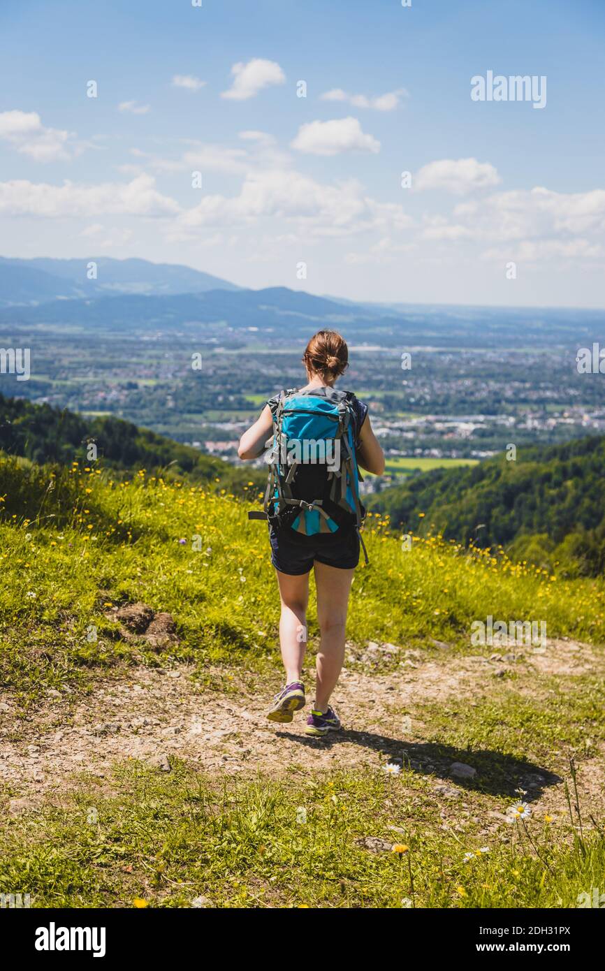 Enjoying the idyllic mountain landscape on Gaisberg: Girl is standing ...