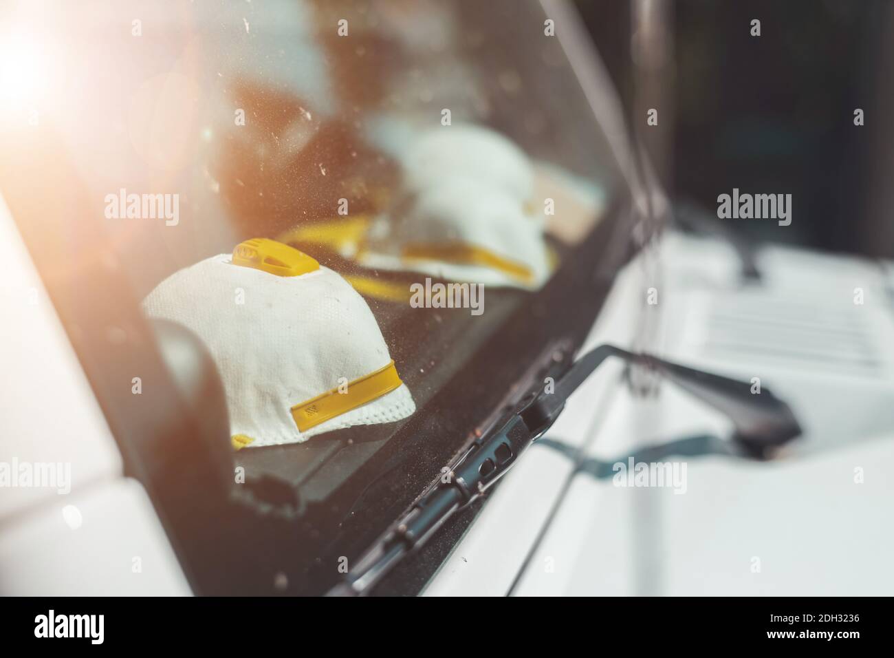 Face mask daily routine concept: Surgical mask in a car behind the ...