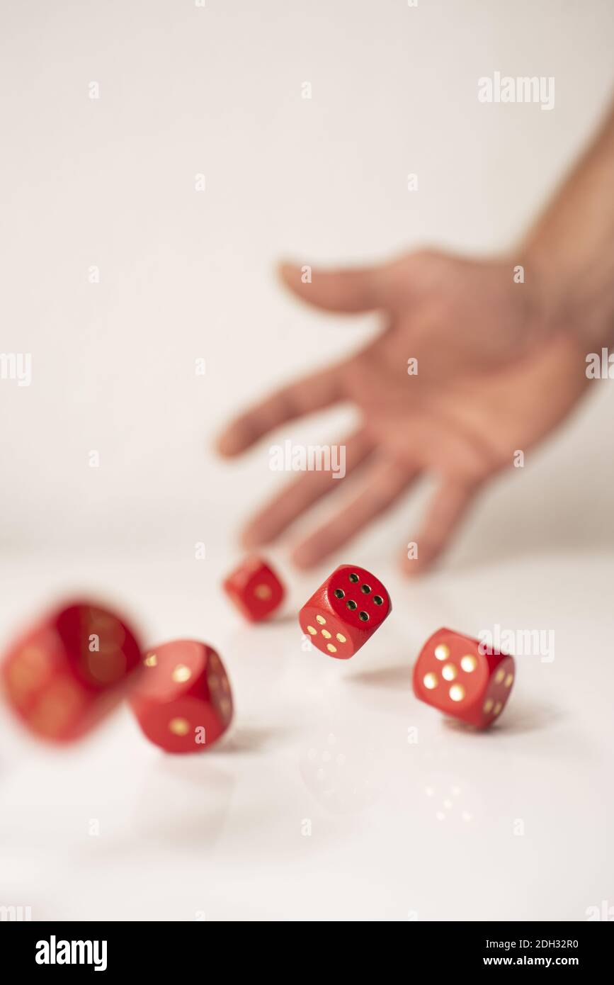 Red Rolling Dices Stock Photo - Alamy